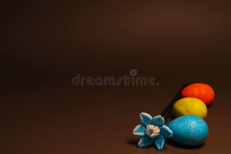 Glass Blue Flower with Colorful Easter Eggs Stock Photo - Image of wood ...