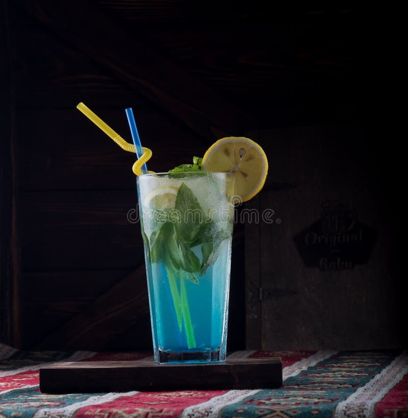 Glass of Blue Summer Cocktail with Lemon and Mint Stock Image - Image ...