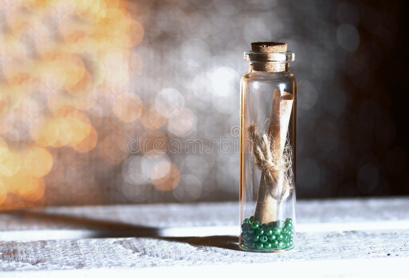 Note in a Glass Bottle. Stands on White Painted Wooden Boards Stock ...