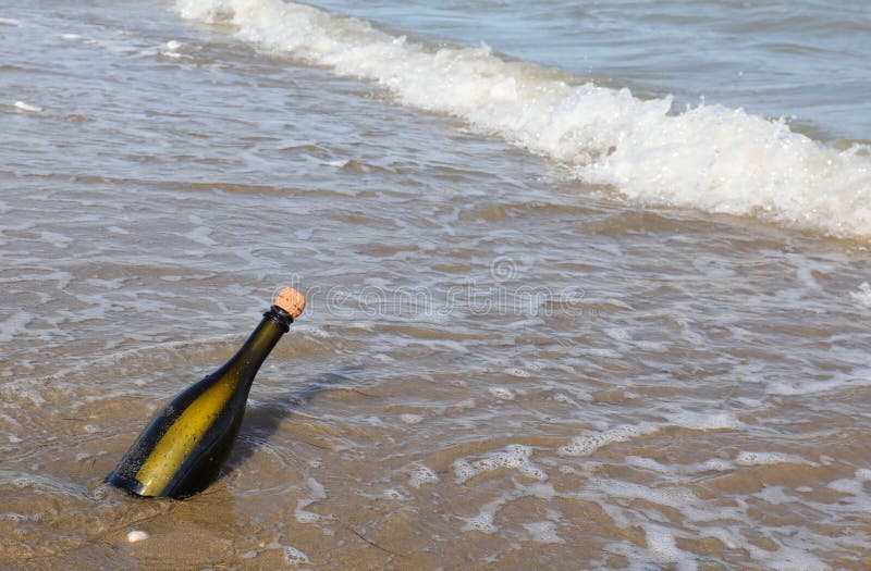 Glass Bottle with a Secret Message Inside on the Beach Stock Image ...
