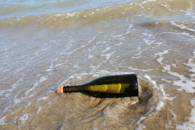 Glass Bottle with a Secret Message Inside on the Beach Stock Image ...