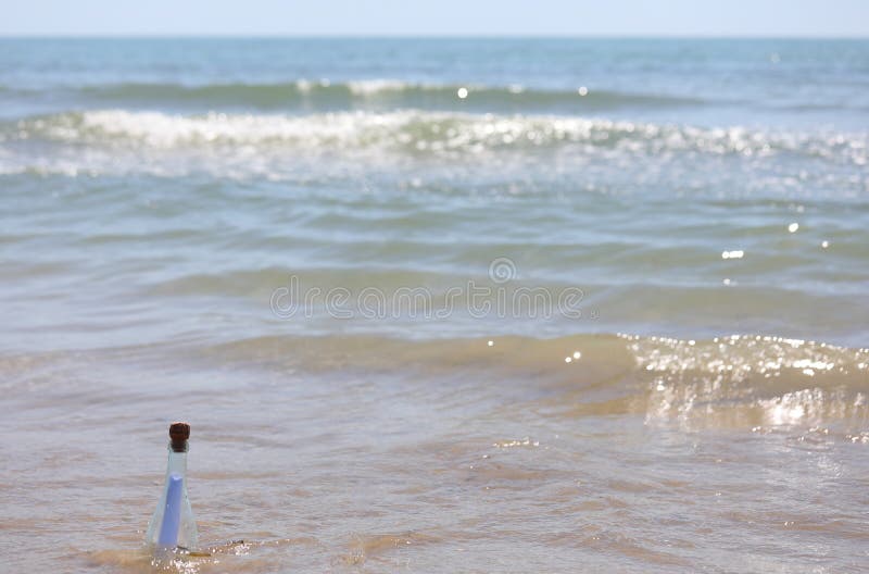 Glass Bottle with Secret Message Inside by the Sea Stock Image - Image ...