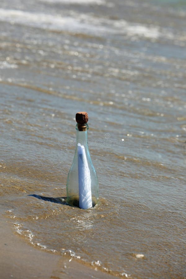 Glass Bottle with Secret Message Inside by the Sea Stock Photo - Image ...