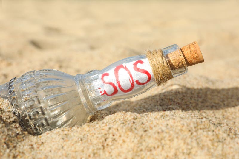 Glass Bottle with SOS Message on Sand, Closeup Stock Image - Image of ...