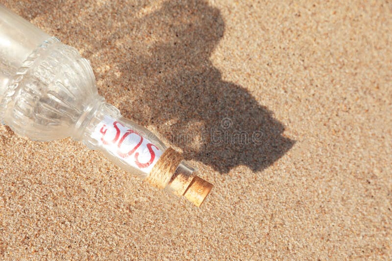 Glass Bottle with SOS Message on Sand, Top View Stock Image - Image of ...
