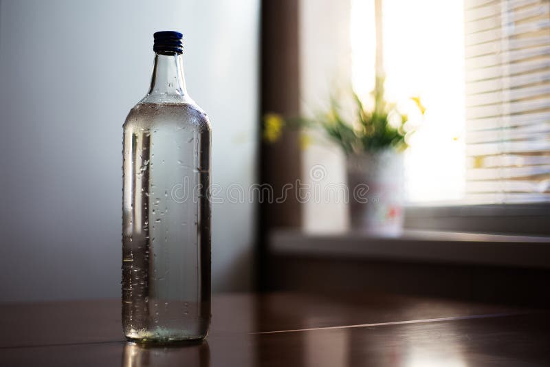 Glass Bottle with Water on the Table Stock Photo - Image of design ...