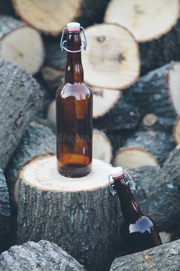 Glass Bottle on Wooden Stack Stock Image - Image of glass, closeup ...