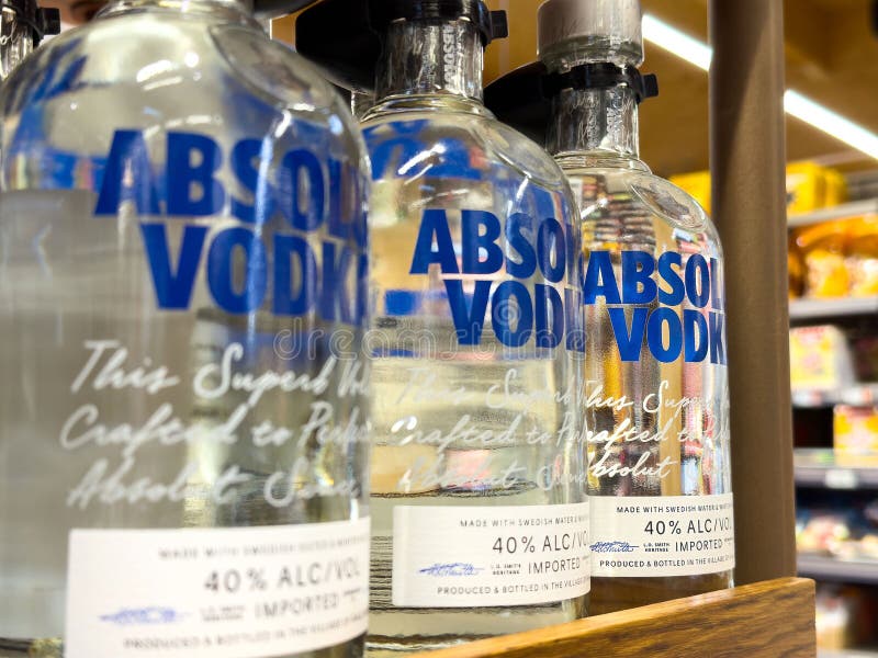 Glass Bottles of Absolut Vodka on Store Shelf with Focused Labels ...