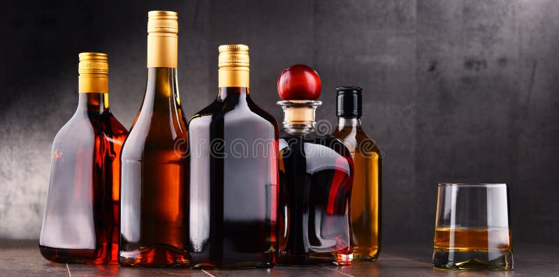 Glass and Bottles of Assorted Alcoholic Beverages. Stock Image - Image ...