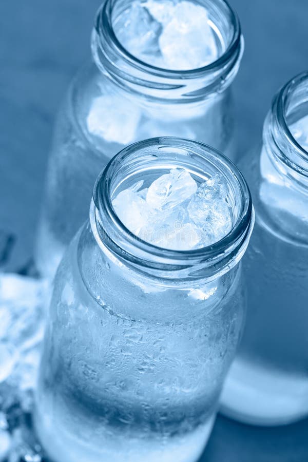 Glass Bottles with Cold Water and Ice Stock Photo - Image of healthy ...