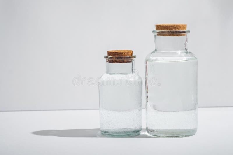 Glass Bottles with Cork Lids on a White Background, Side View Stock ...