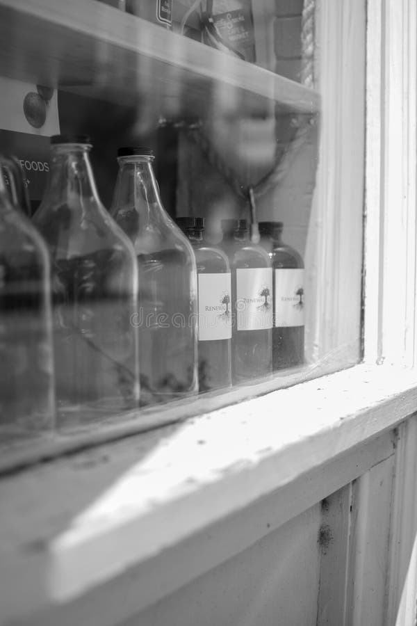 Glass Bottles Lined Up for Display in a Vendor Window Editorial ...