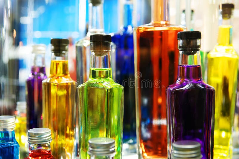 Glass Bottles with Multi-colored Alcohol. Close-up Stock Image - Image ...