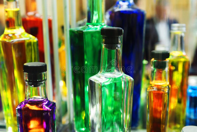 Glass Bottles with Multi-colored Alcohol. Close-up Stock Photo - Image ...