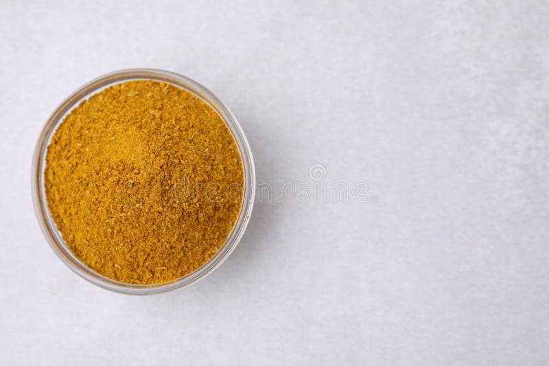 Glass Bowl with Curry Powder on White Table, Top View. Space for Text ...