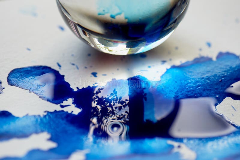 Glass Bowl and Reflection in Blue Ink Puddle.Abstraction. Stock Image ...