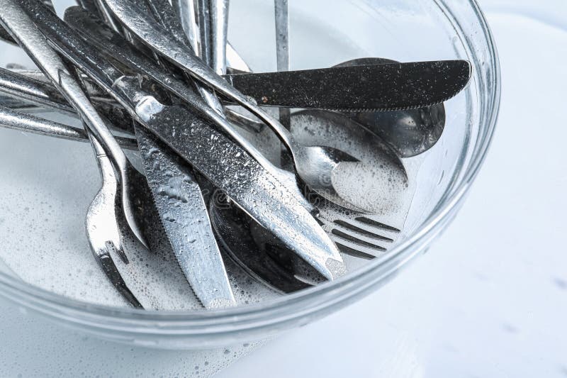 Glass Bowl with Silverware in Foam, Above View Stock Photo - Image of ...