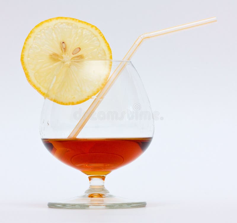 Glass of brandy stock photo. Image of lemon, home, liquid - 11417350