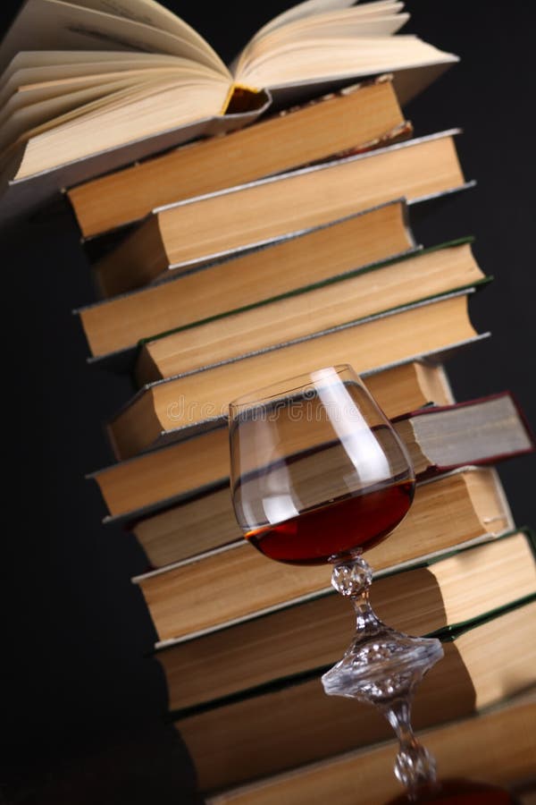 Glass of brandy and books stock photo. Image of classic - 42057448