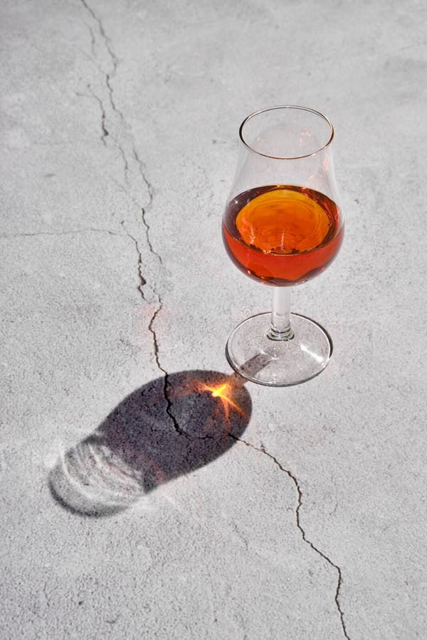 Glass of Brandy on Concrete Surface Stock Photo - Image of concrete ...