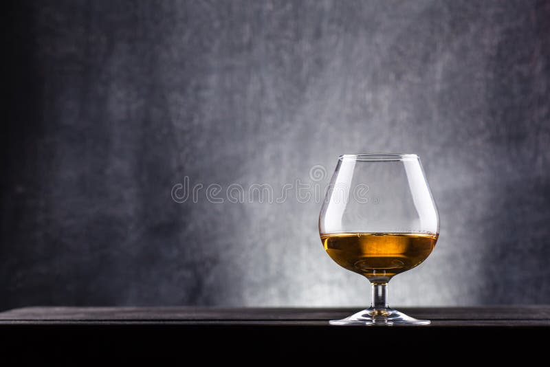 Glass of brandy stock photo. Image of texture, wood, board - 80205412