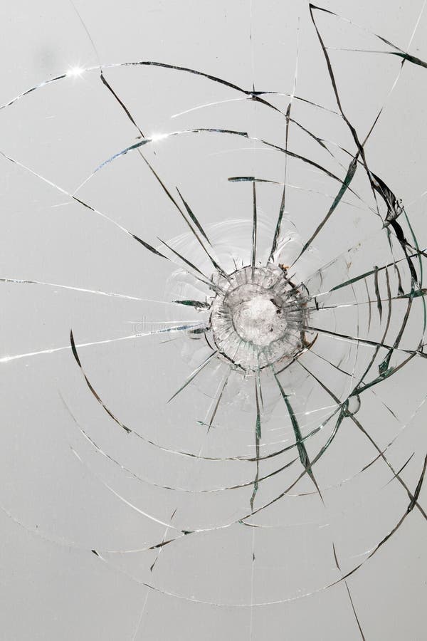 Glass Breaks Under Impact: Bullet Hole and Cracks Stock Image - Image ...