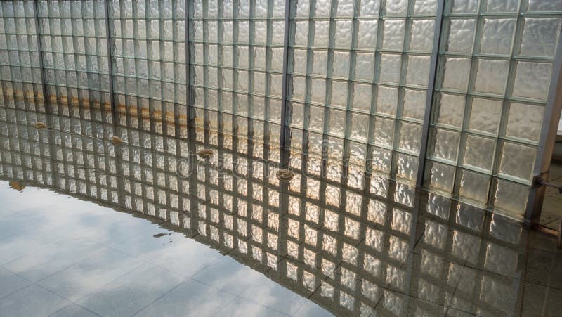 Glass Brick Wall Reflected in Water Stock Photo - Image of abstract ...