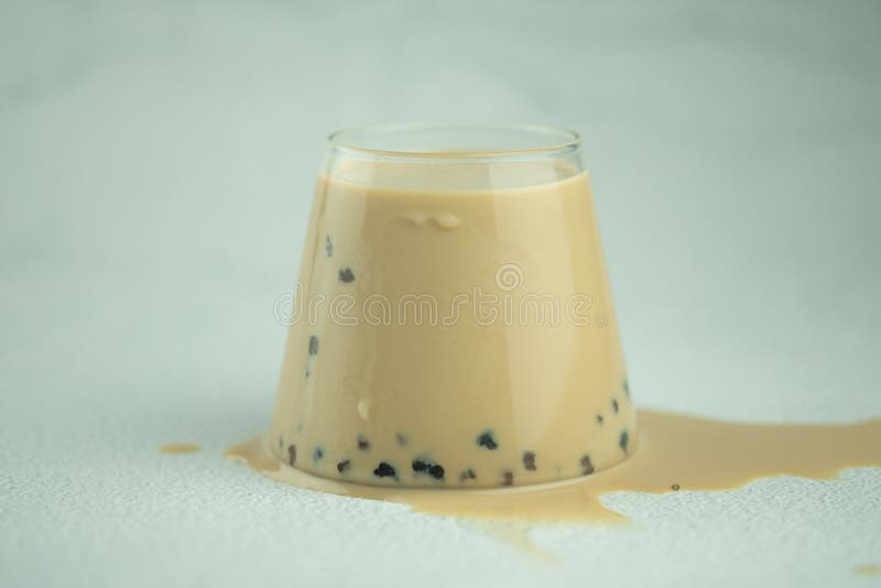Glass of Bubble Milk Tea and Spilled Milk Tea on Floor Stock Image ...