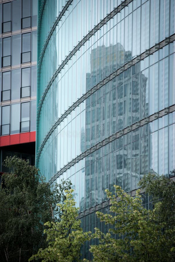Glass Building Facade with Reflection and Trees Stock Image - Image of city, glass: 355048131