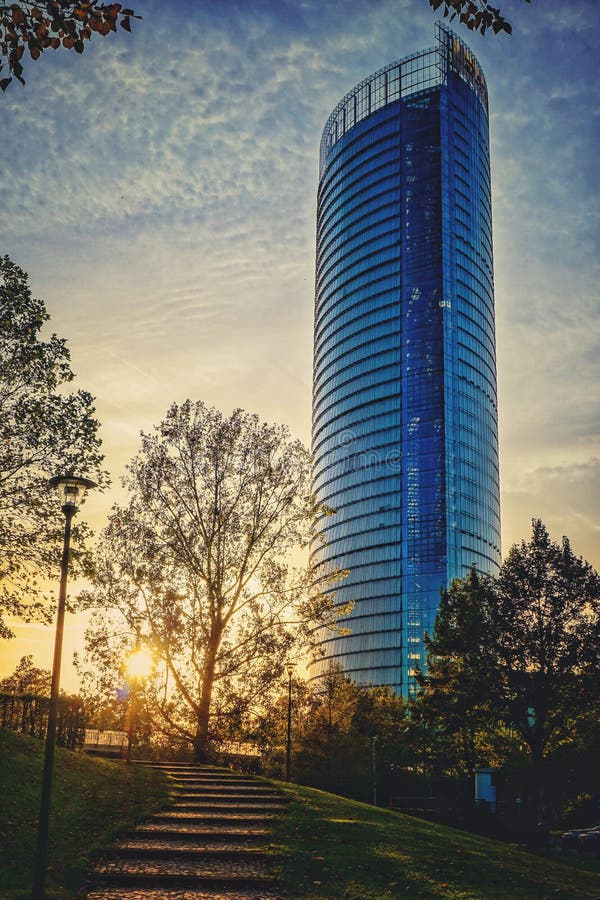 Glass Building in the Sunset Stock Image - Image of tree, tower: 181886897