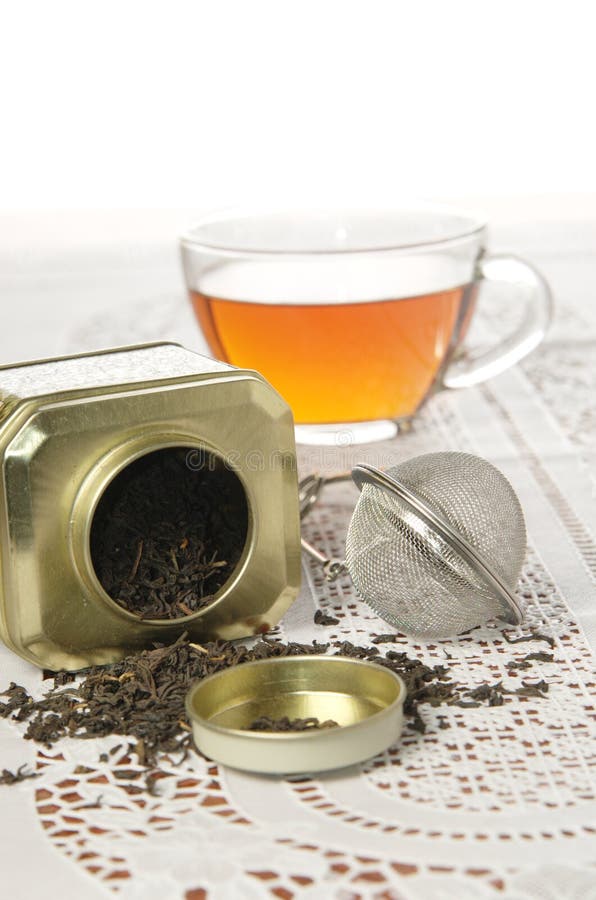Glass Cap of Tea and Organic Black Tea in Metal Can Stock Photo - Image ...