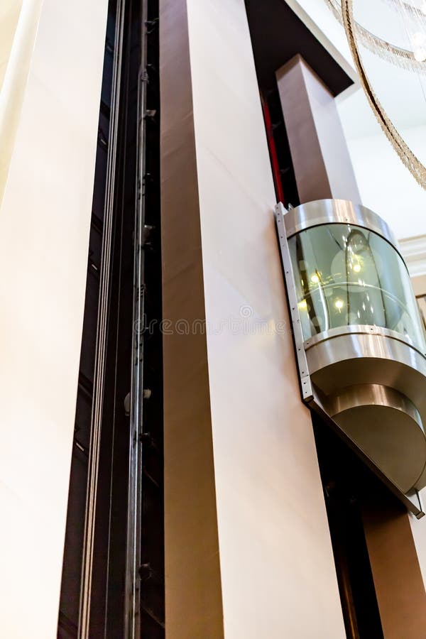 Modern Moving Elevator in Shopping Center. Glass Lift. Stock Image ...