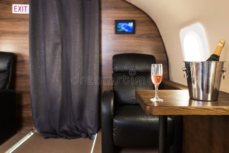 A Glass of Champagne in the Interior of a Private Jet. Flying First ...