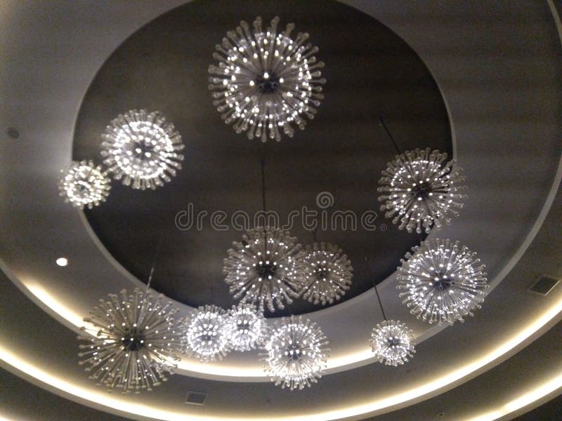 Glass Chandeliers Illuminated with Different Light Intensity, Like ...