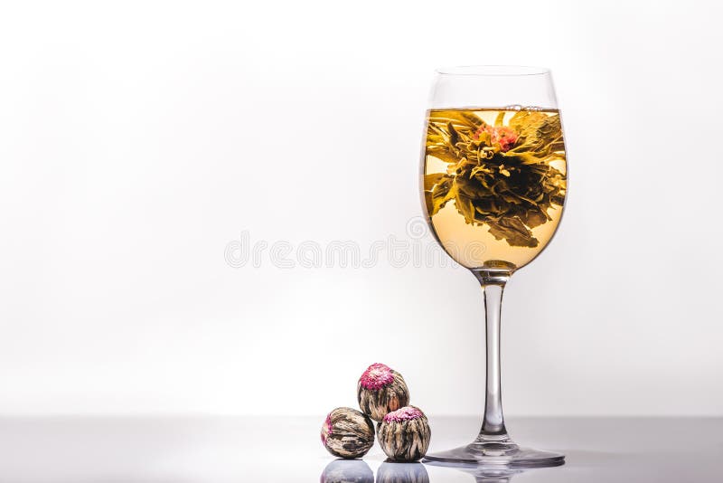 Glass of Chinese Flowering Tea with Tea Balls Stock Photo - Image of ...