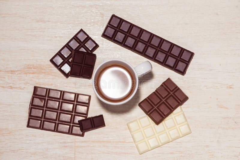 Glass of Chocolate Milk and Variety Chocolates on Table Stock Image ...