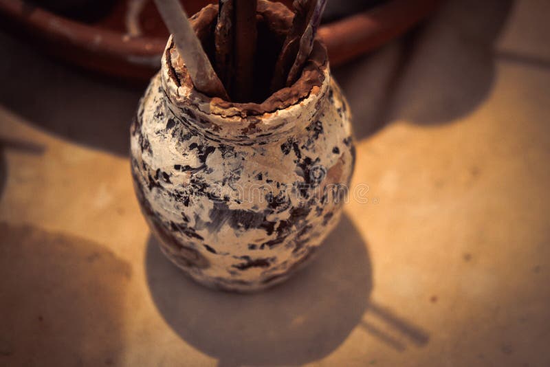 A Glass Stained with Smeared Clay with Tassels Stock Photo - Image of ...