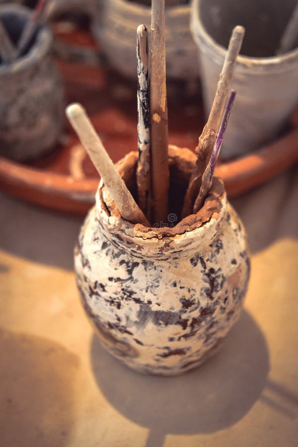 A Glass Stained with Smeared Clay with Tassels Stock Image - Image of ...