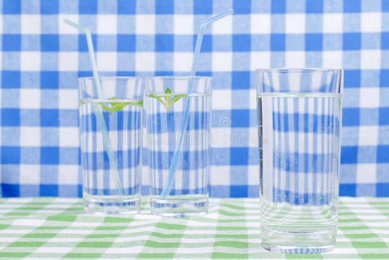 Glass of Clean Water on a Table Covered with a Checkered Napkin Stock ...