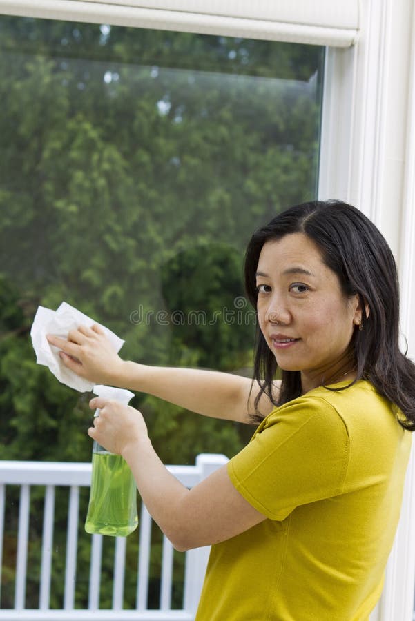 Girl cleaning windows stock image. Image of housekeeping - 76527375