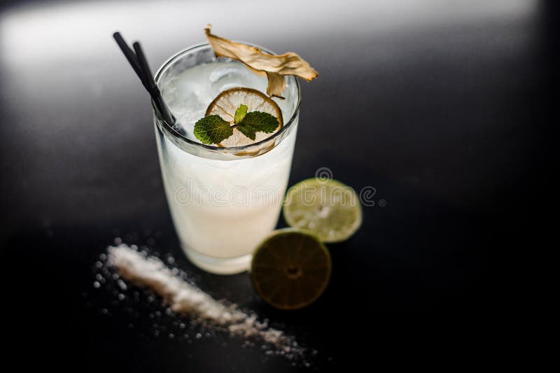 Glass of Clear Alcoholic Cocktail Decorated with a Slice of Lime Stock ...