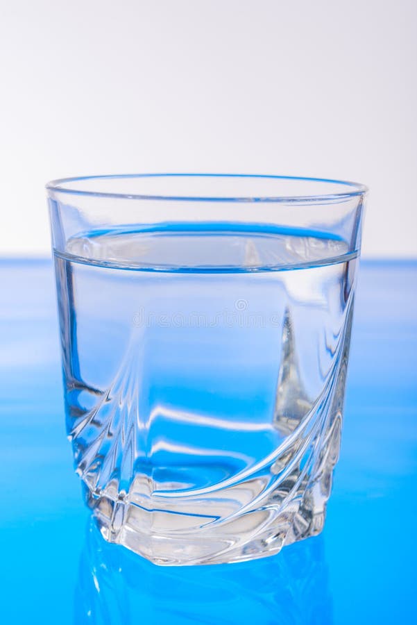 Glass with clear water stock photo. Image of flow, beverage - 130593832