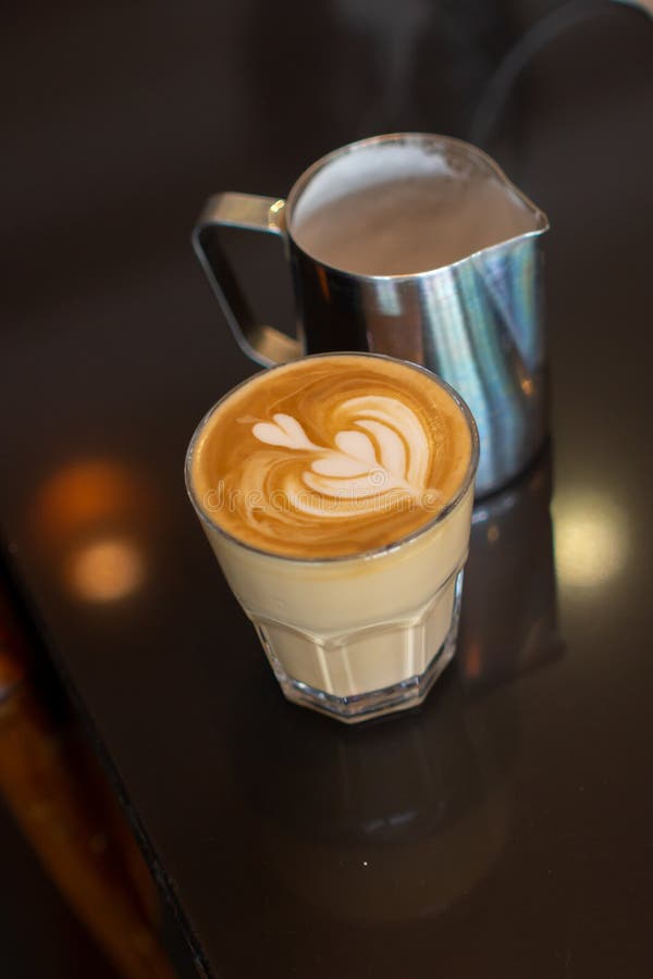 A Glass of Coffee with Latte Art on the Table Stock Photo - Image of ...