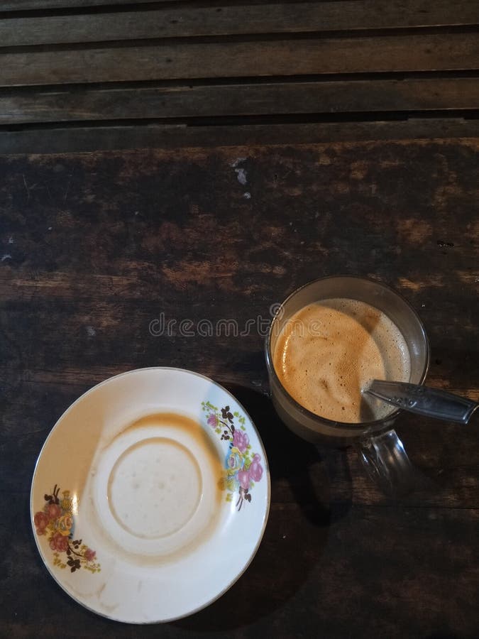 A Glass of Coffee on Table at Night Stock Image - Image of glass, table ...