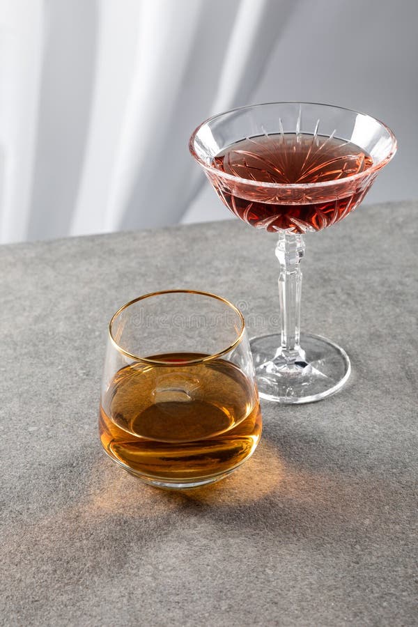 Glass of Cognac Near Red Wine Stock Photo - Image of alcoholic, liquid ...
