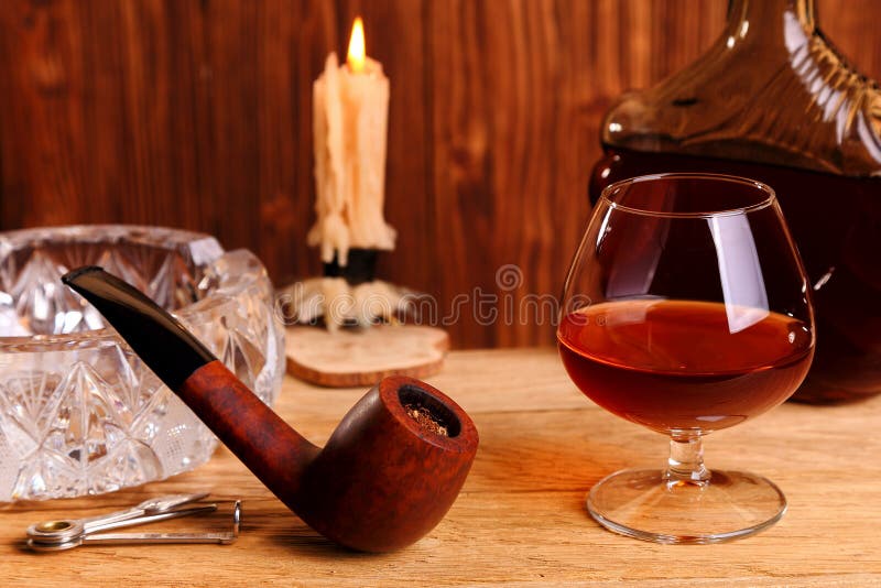 A Glass of Cognac and Smoking Pipe Stock Photo - Image of drink, cognac ...