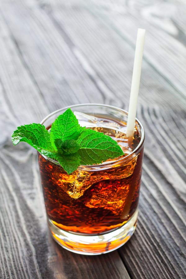 Glass of Cola with Ice and Fresh Mint on Wooden Table. Stock Image ...