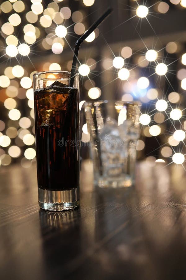 Glass of Cold Alcohol Drink with Ice on Table Stock Photo - Image of ...