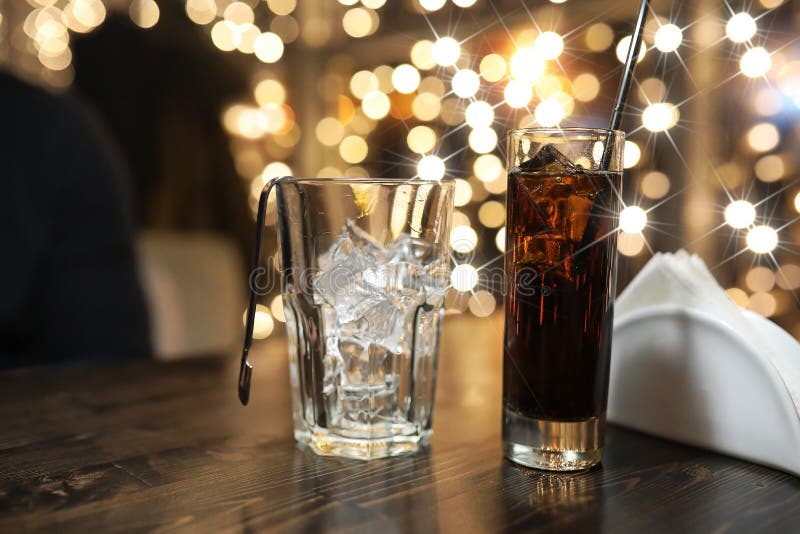 Glass of Cold Alcohol Drink with Ice on Table Stock Photo - Image of ...
