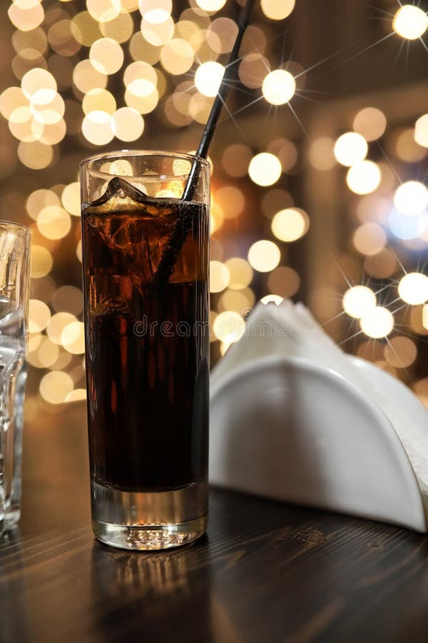 Glass of Cold Alcohol Drink with Ice on Table Stock Image - Image of ...